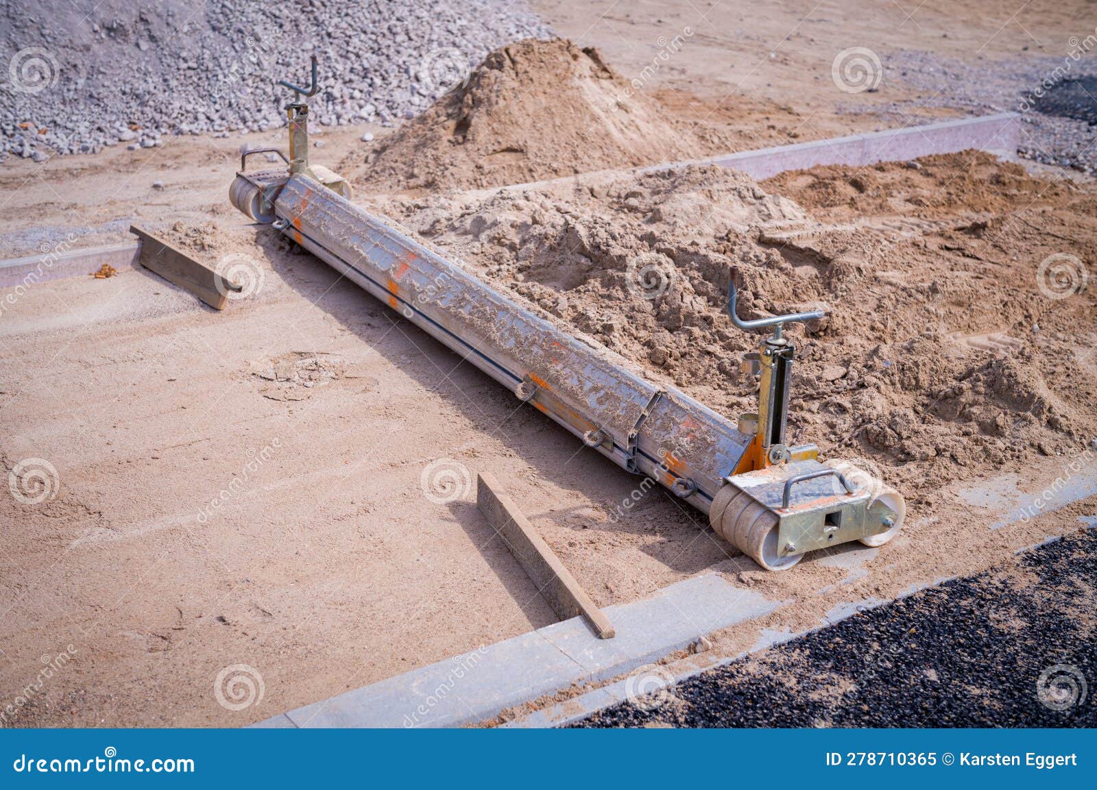 Gravel is Pulled Straight with a Small Machine To Lay Paving Stones ...