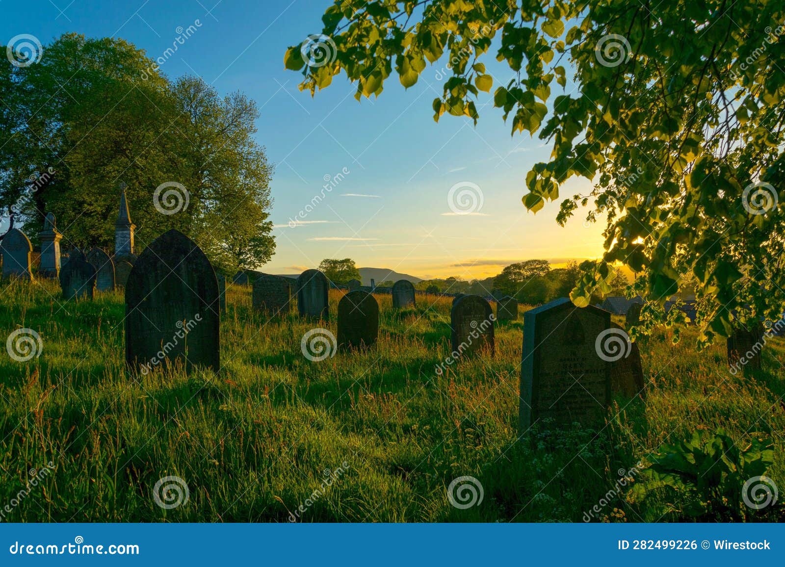 Graveyard at Sunset Withe the Headstones in a Meadow. Stock Photo ...