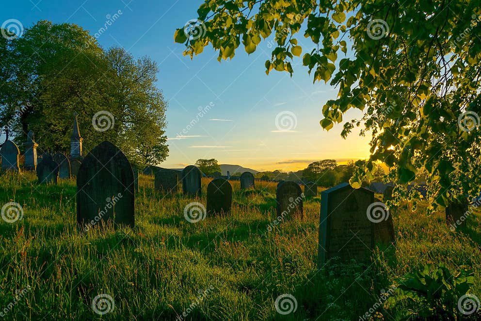 Graveyard at Sunset Withe the Headstones in a Meadow. Stock Photo ...