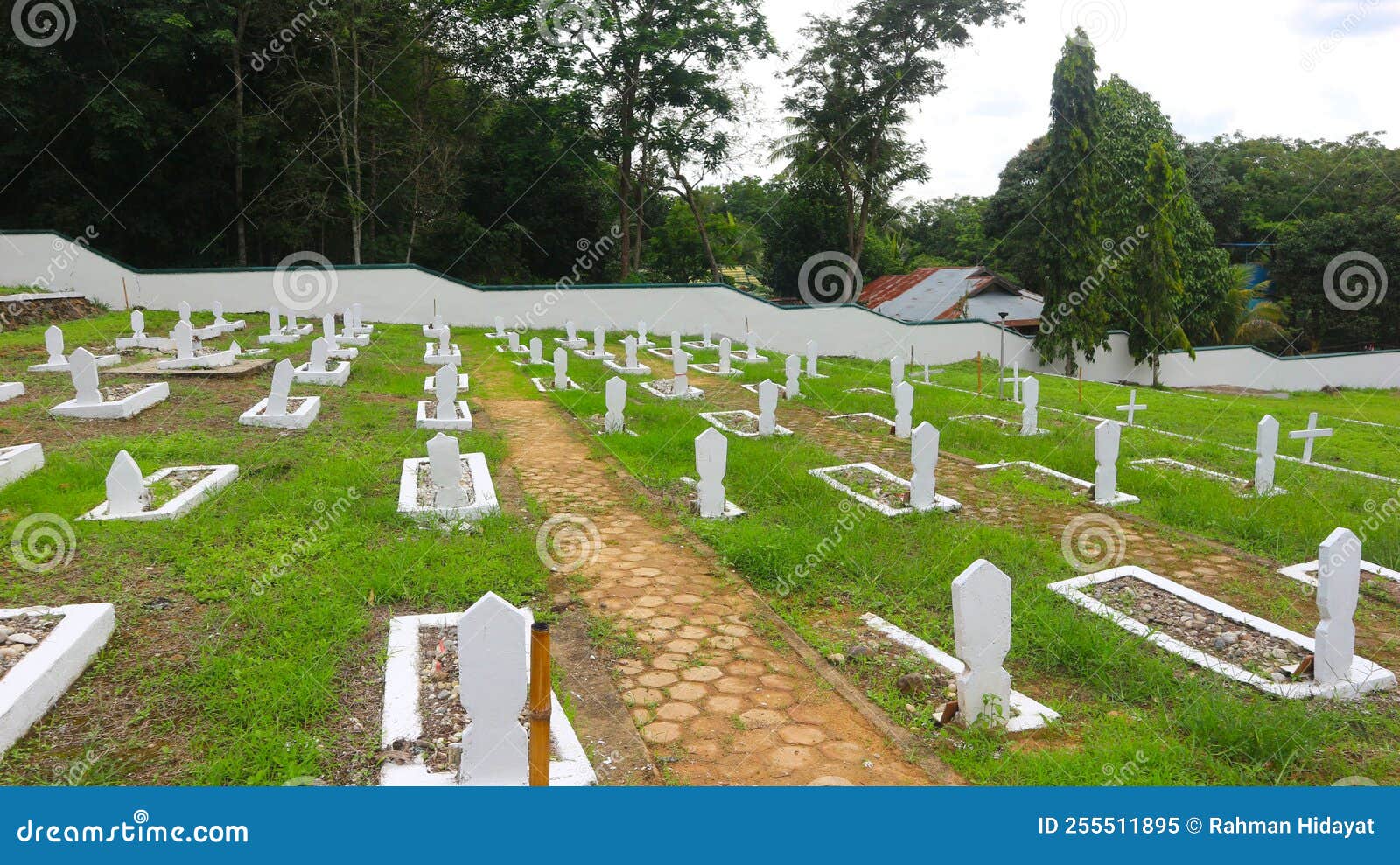 Graveyard with White Cement Walls and Green Grass for the Dead Stock ...