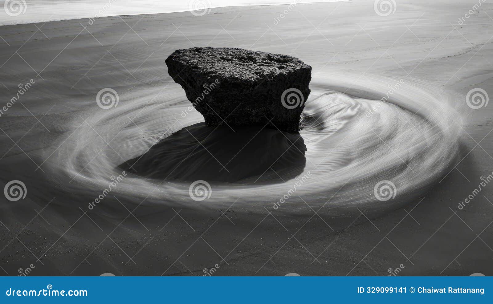 Gravity-Defying Lone Rock and Vortex of Black and White Sand in Surreal ...