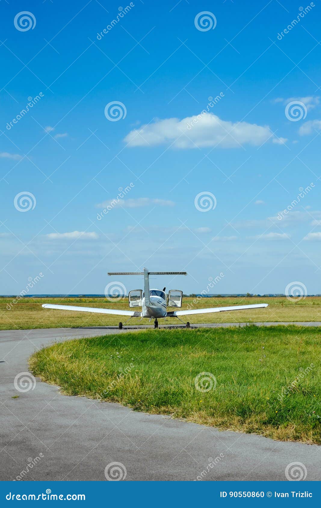 Gray Airplane Parked on the Grass at the Airfield Stock Photo - Image ...