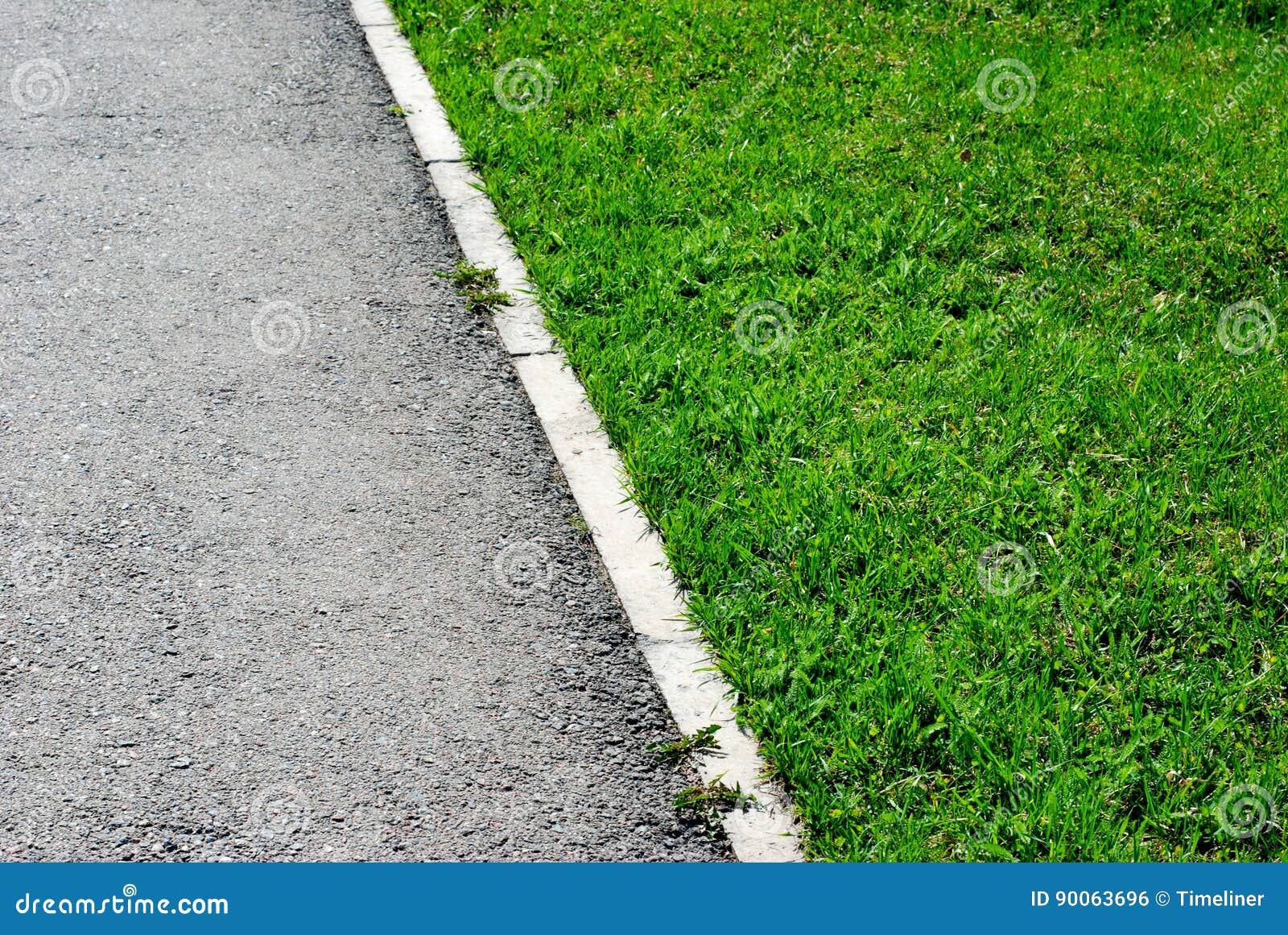 Gray Asphalt and Green Grass Border in Perspective Stock Photo - Image ...