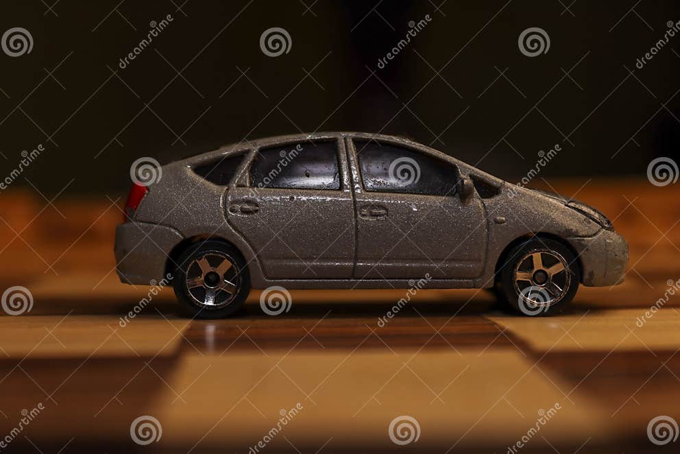 A Gray Automobile Toy with Various Unique Patterns on it is Shown on a ...