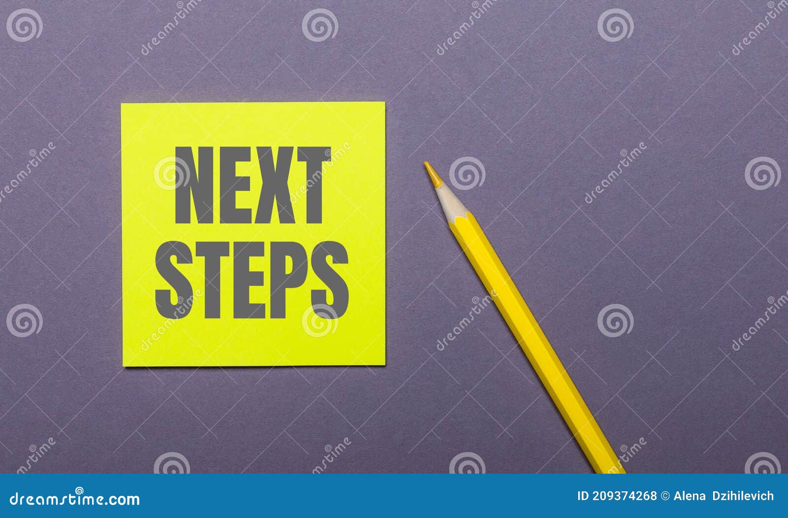 On a Gray Background, a Bright Yellow Pencil and a Yellow Sticker with ...