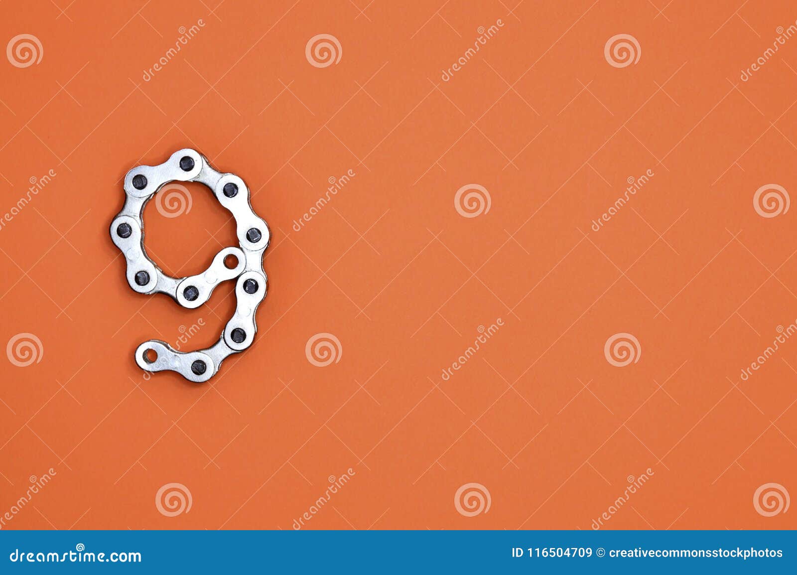 Gray Bicycle Chain On Orange Surface Picture. Image: 116504709