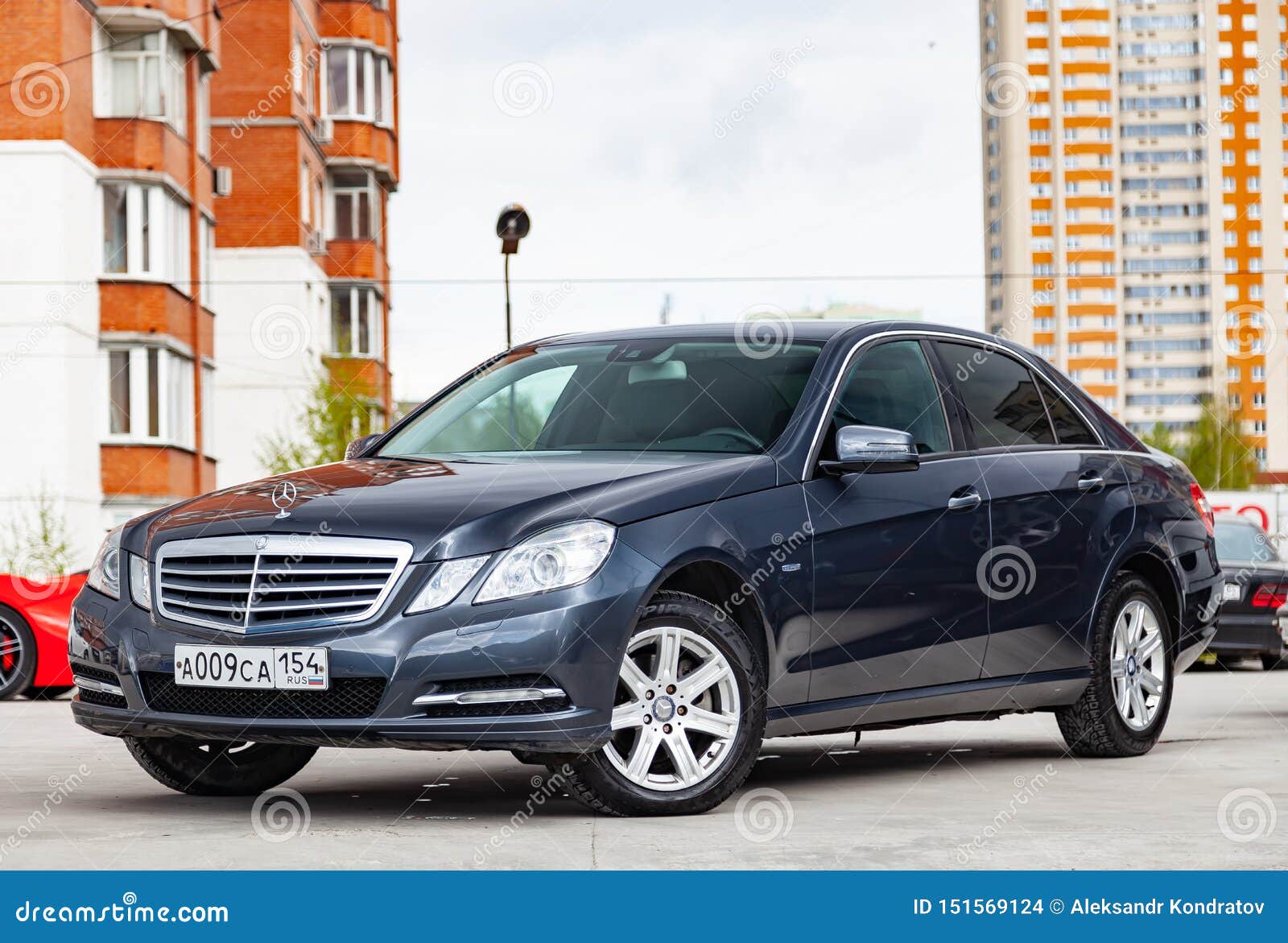 Gray and Blue Mercedes Benz E-class E200 2010 Year Front View with Dark ...