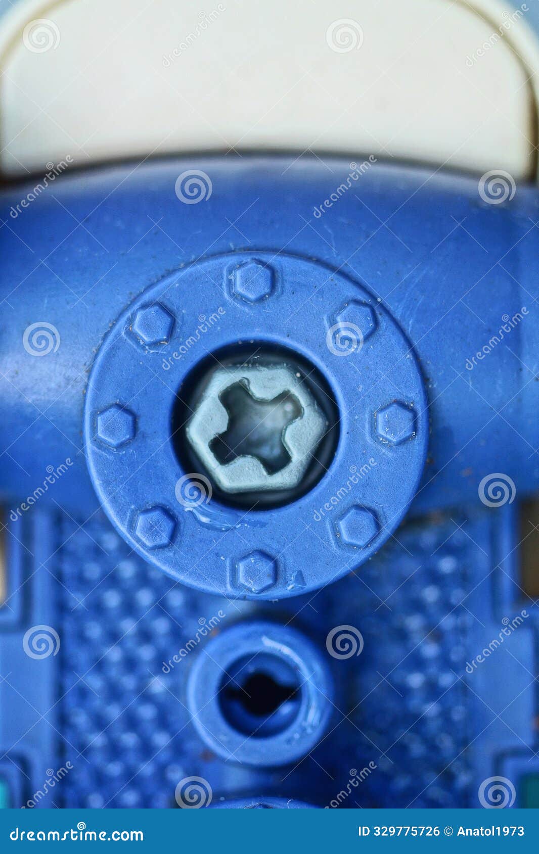 Gray Bolt Screwed into a Piece of Blue Plastic Toy Stock Photo - Image ...