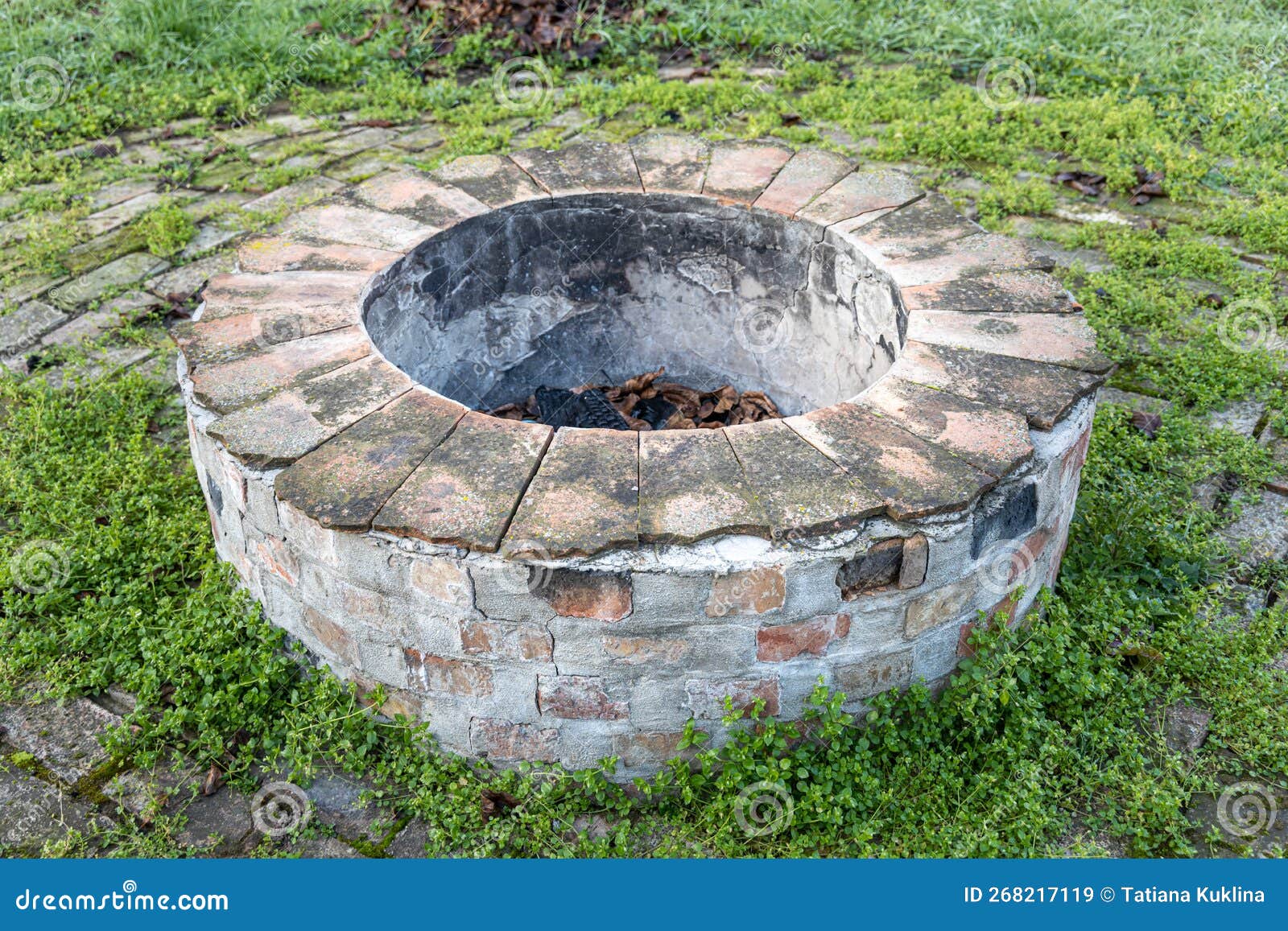 Gray and Brown Round Fire Hearth with Orange Bricks for a Bonfire on ...