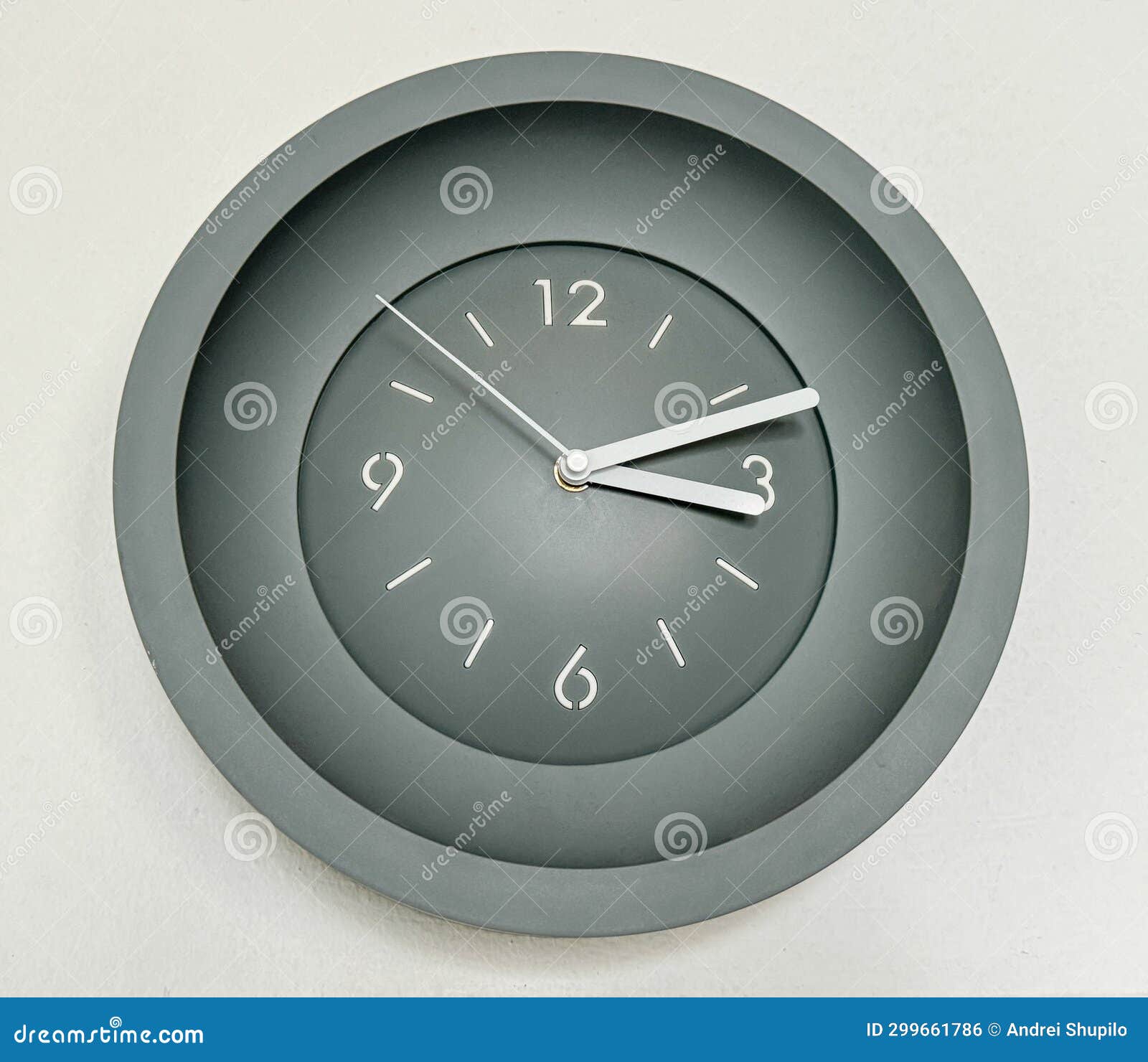 Gray clock on a white wall stock photo. Image of watch - 299661786