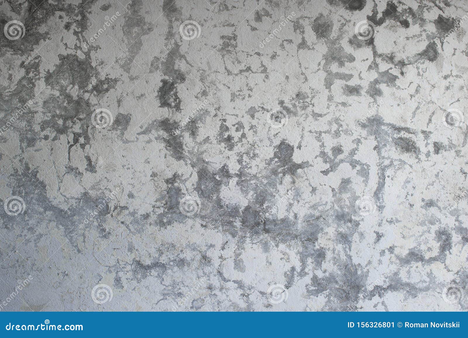 A Gray Concrete Wall with a Vertical Lighting Gradient Interspersed ...