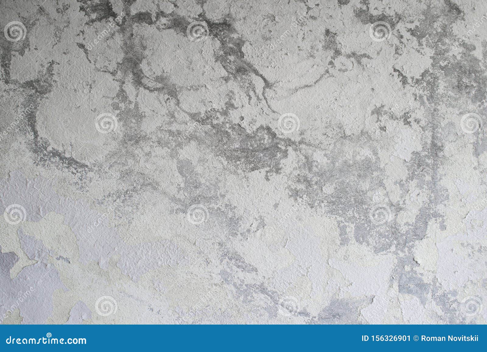 A Gray Concrete Wall with a Vertical Lighting Gradient Interspersed ...