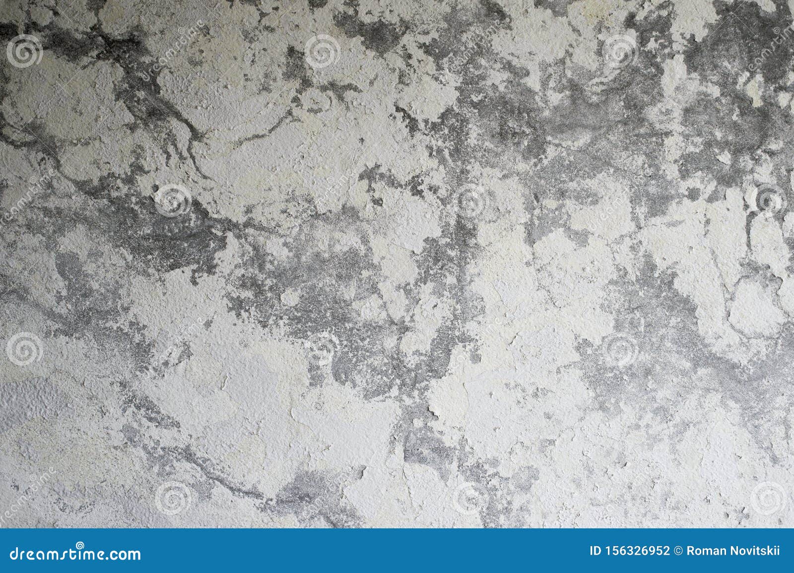 A Gray Concrete Wall with a Vertical Lighting Gradient Interspersed ...