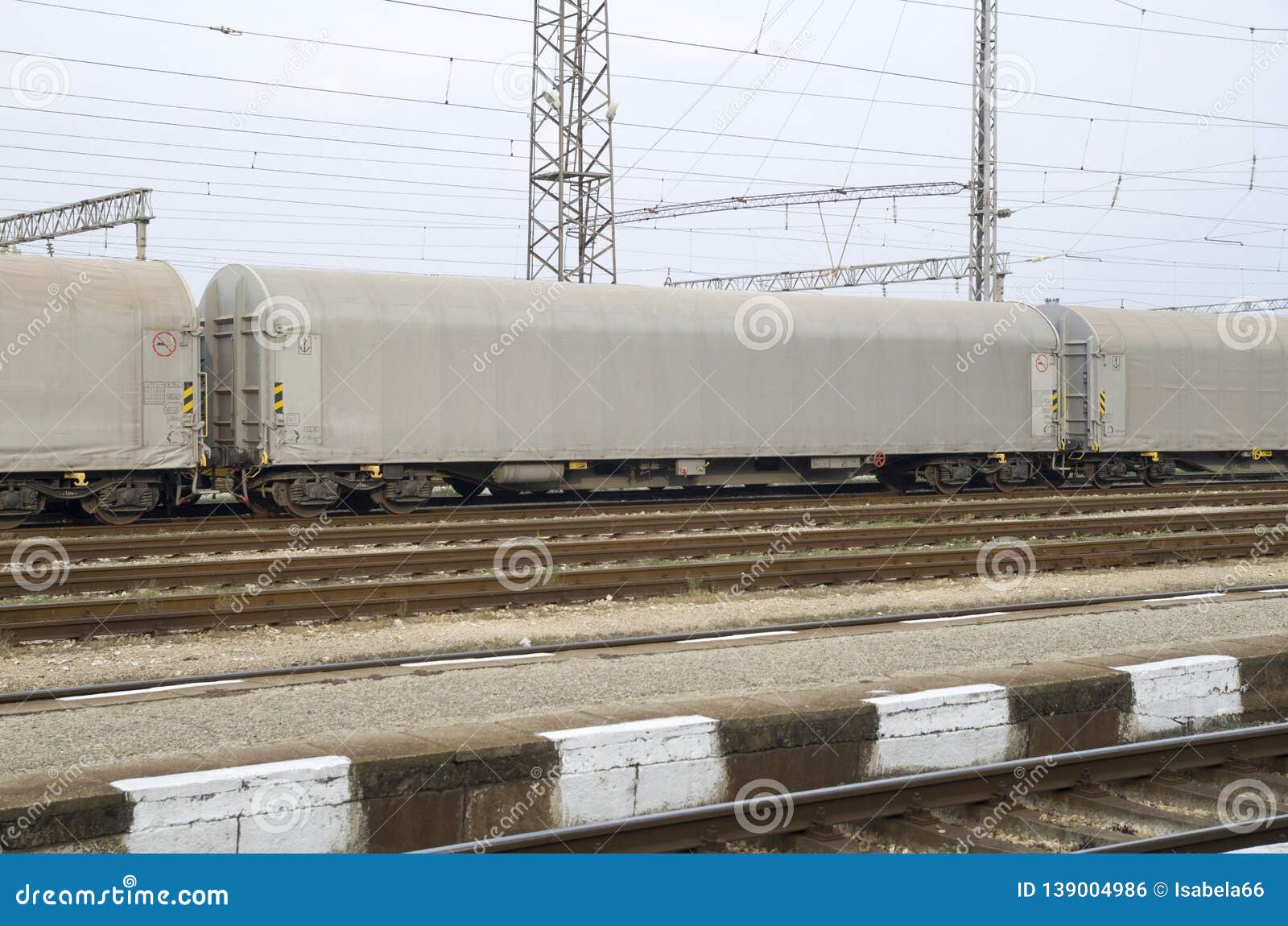 Gray Freight Train with Tented Wagons Stock Photo - Image of covered ...