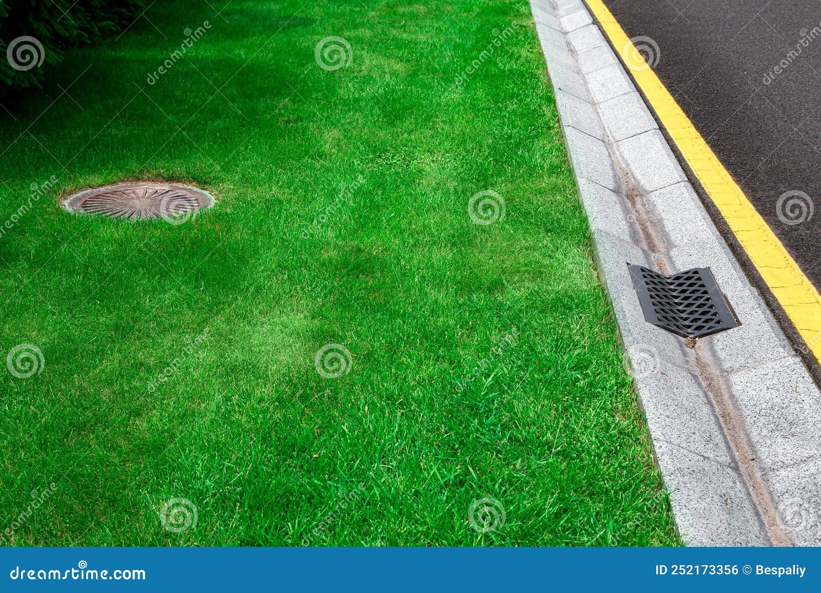Gray Gutter of a Stormwater System on the Side of Asphalt Road. Stock ...