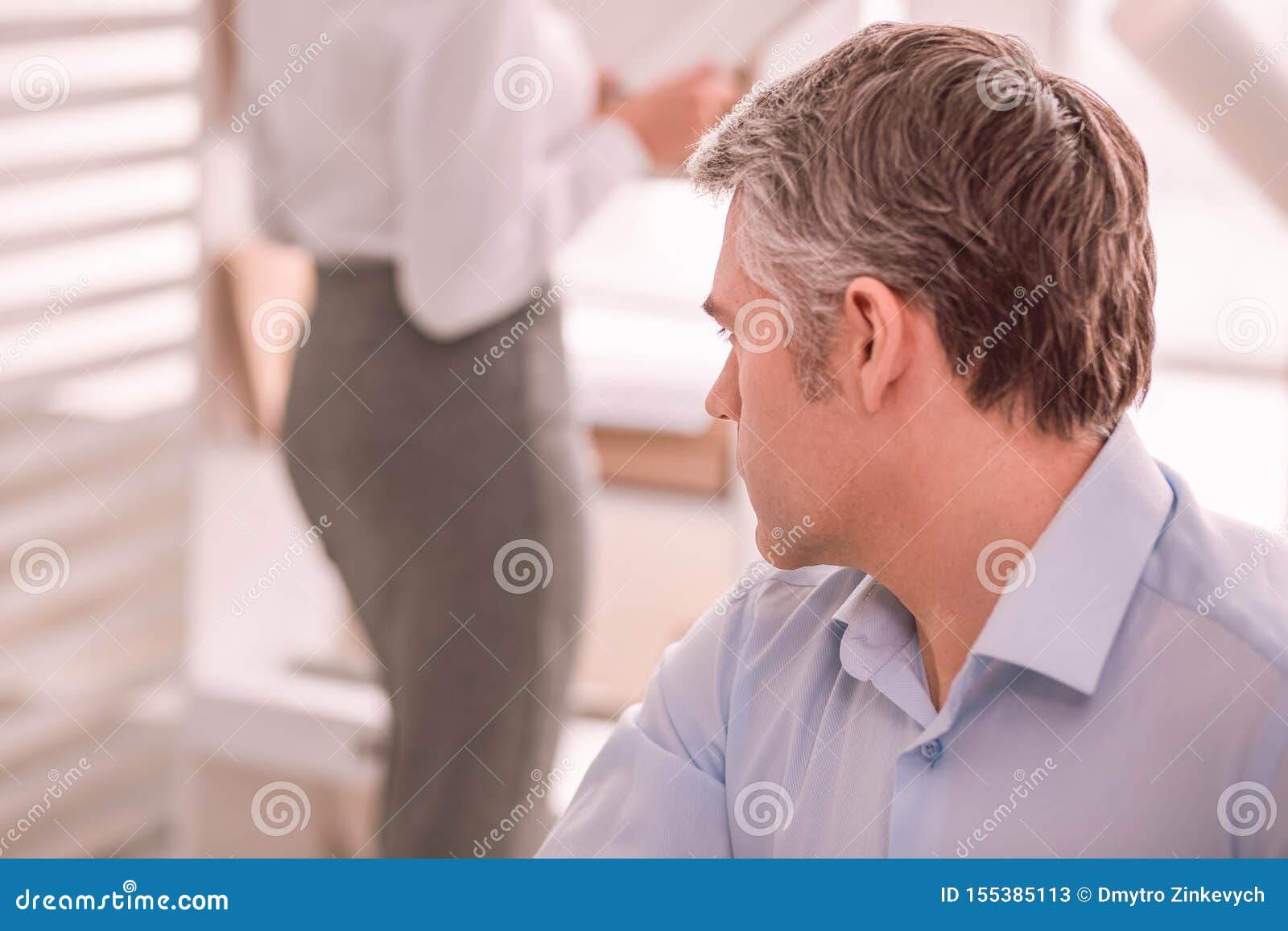 Gray-haired Man Glancing at His Colleagues Backside Stock Image - Image ...