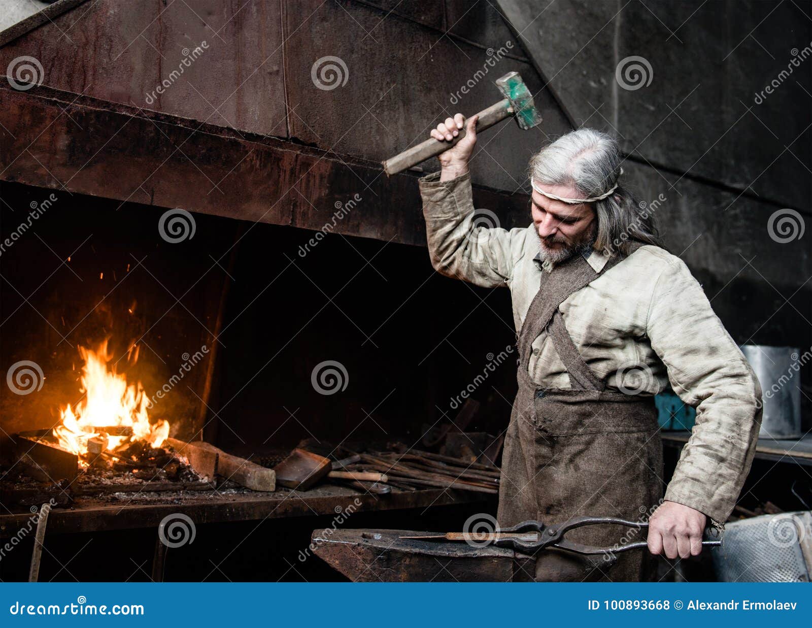 Gray-haired Smith Forges Detail in the Smithy Stock Photo - Image of ...