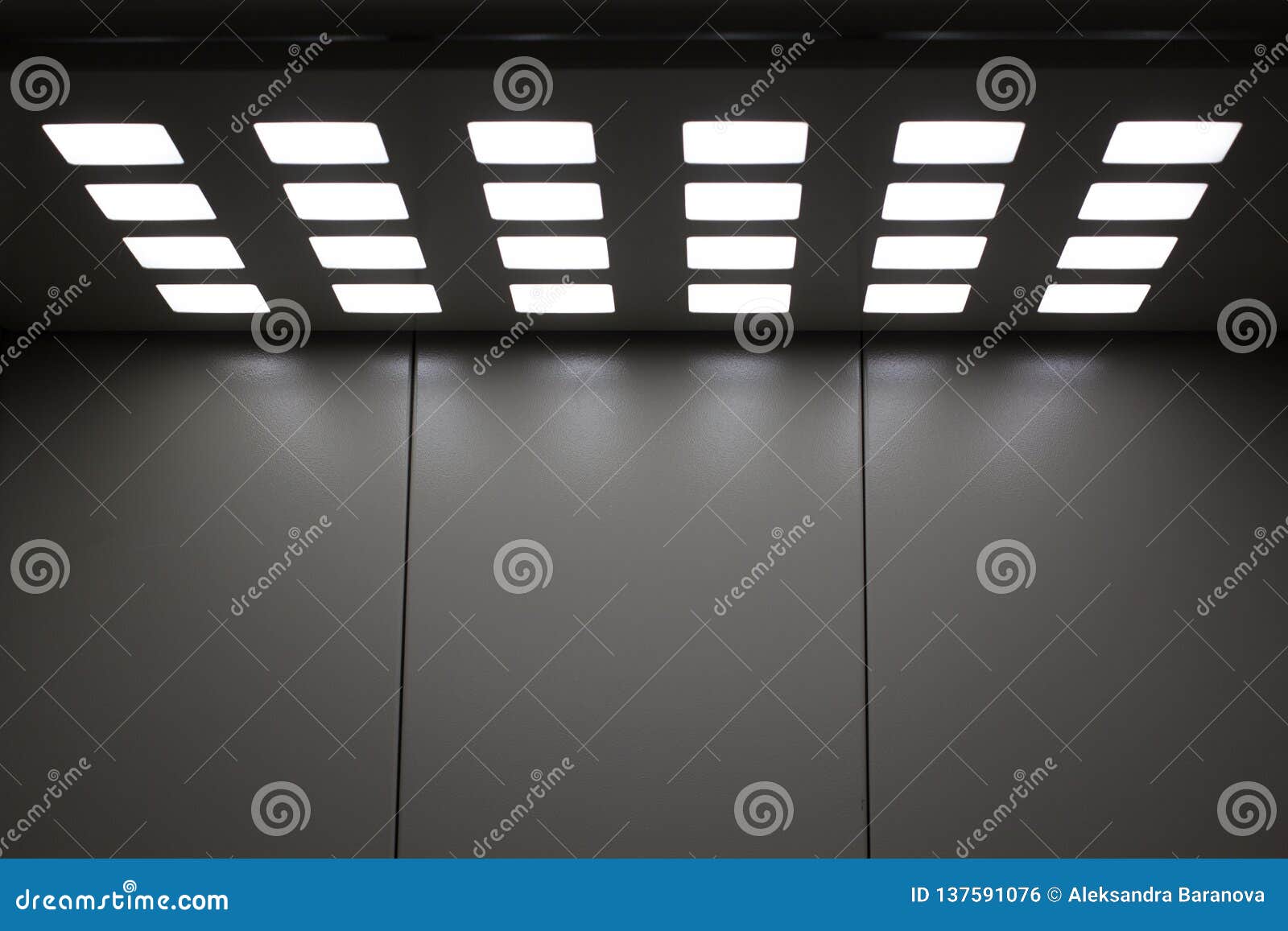 Gray Metal Elevator with Square Lamps in the Ceiling Stock Photo ...