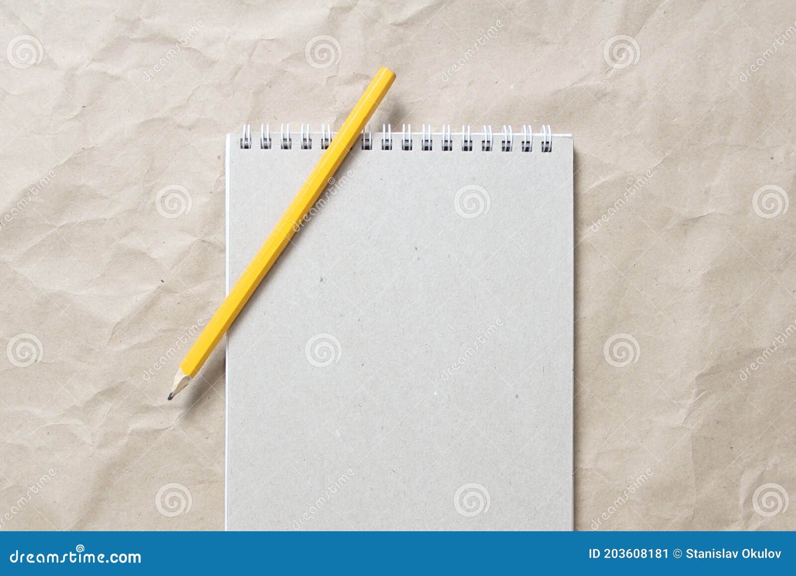 Gray Notepad with White Coiled Spring and Pencil on a Background of ...
