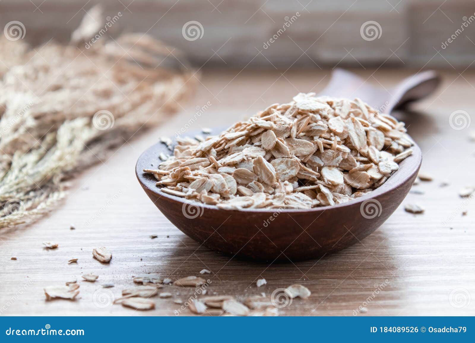 Gray Oatmeal in a Larger Spoon on the Table. the Concept of a Healthy ...