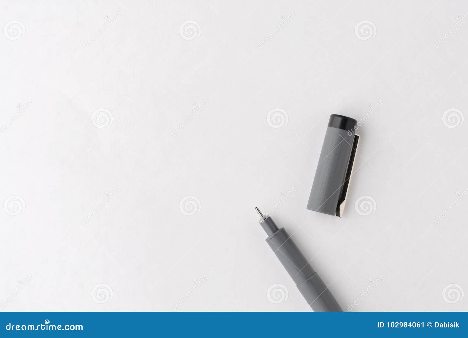 A Gray Pen on a Blank White Sheet of Paper Stock Image - Image of macro ...