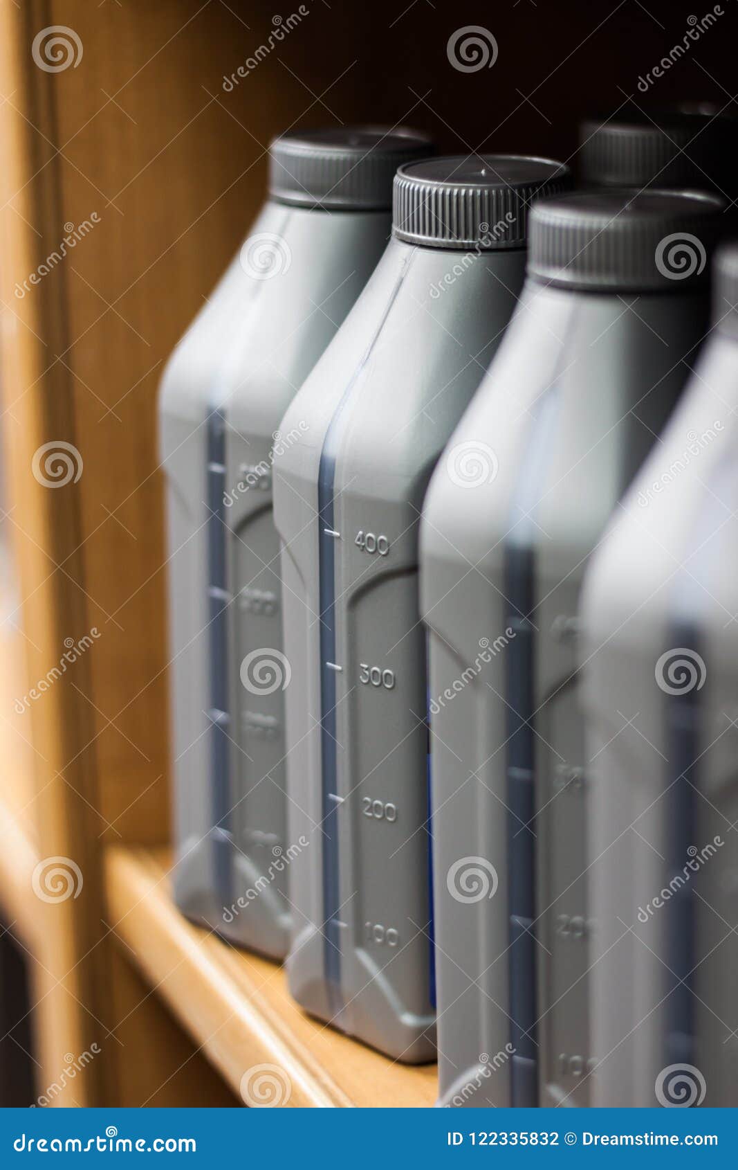 Gray Plastic Cans of Motor Oils Stock Photo - Image of canister, blank ...
