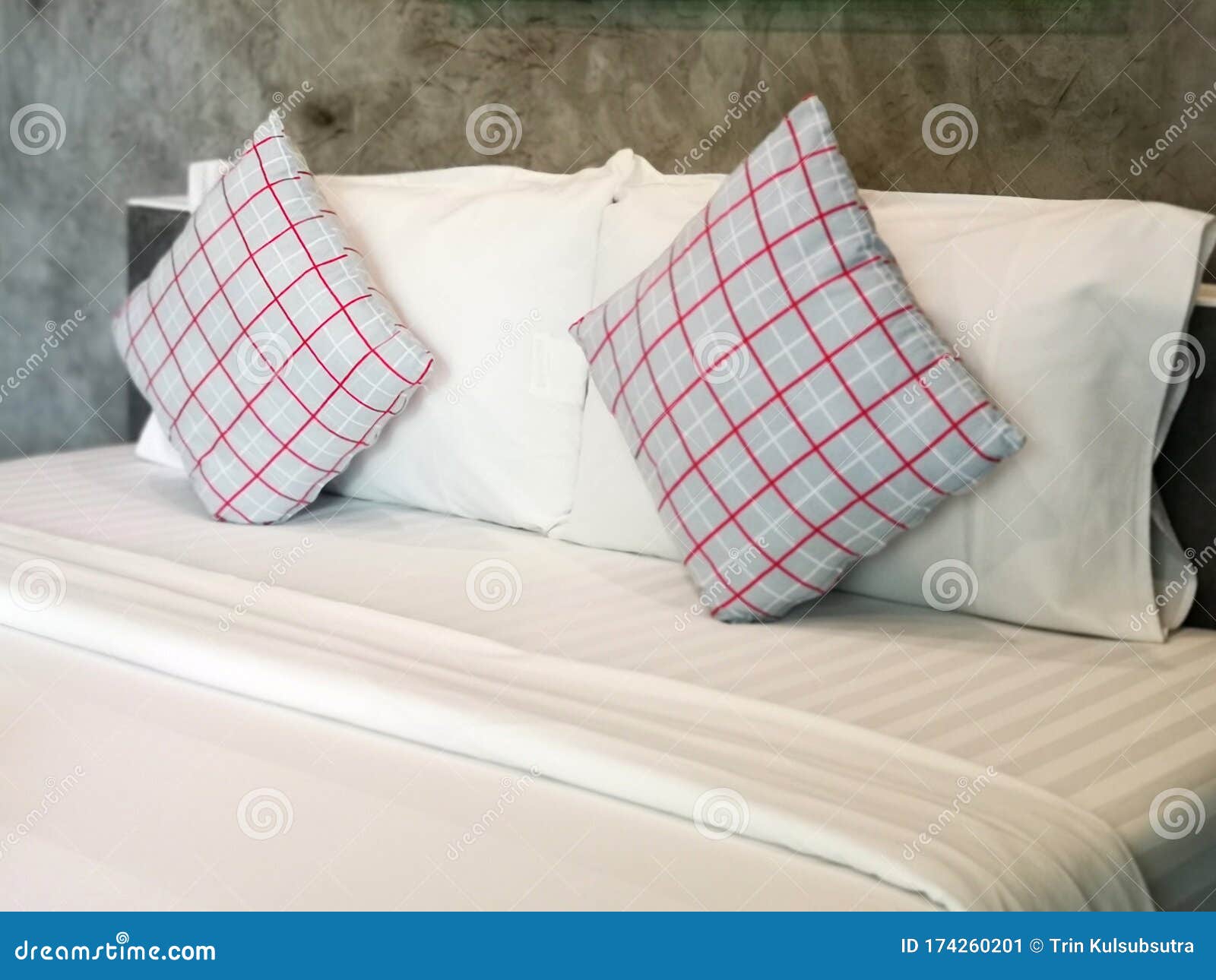 The Gray Square Pillows Red Checkered Pattern on a White Bed Set Stock ...