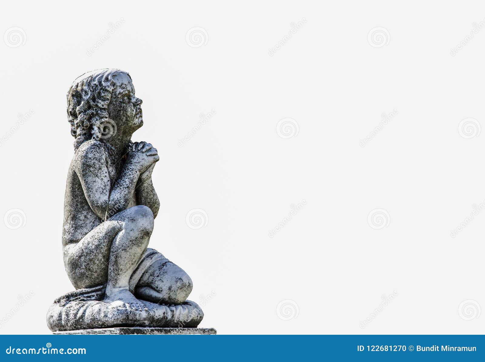 Gray Stone Boy Statue Sitting and Praying at a Cemetery Isolated on ...