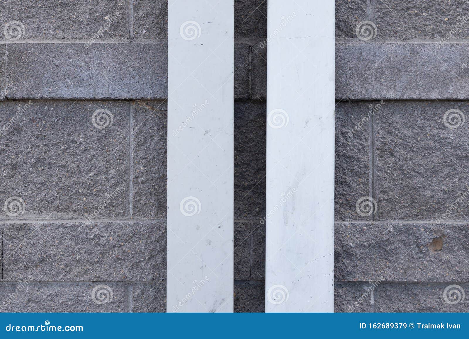 Gray Stone Brick Wall with Two White Long Stripes in the Centre of ...