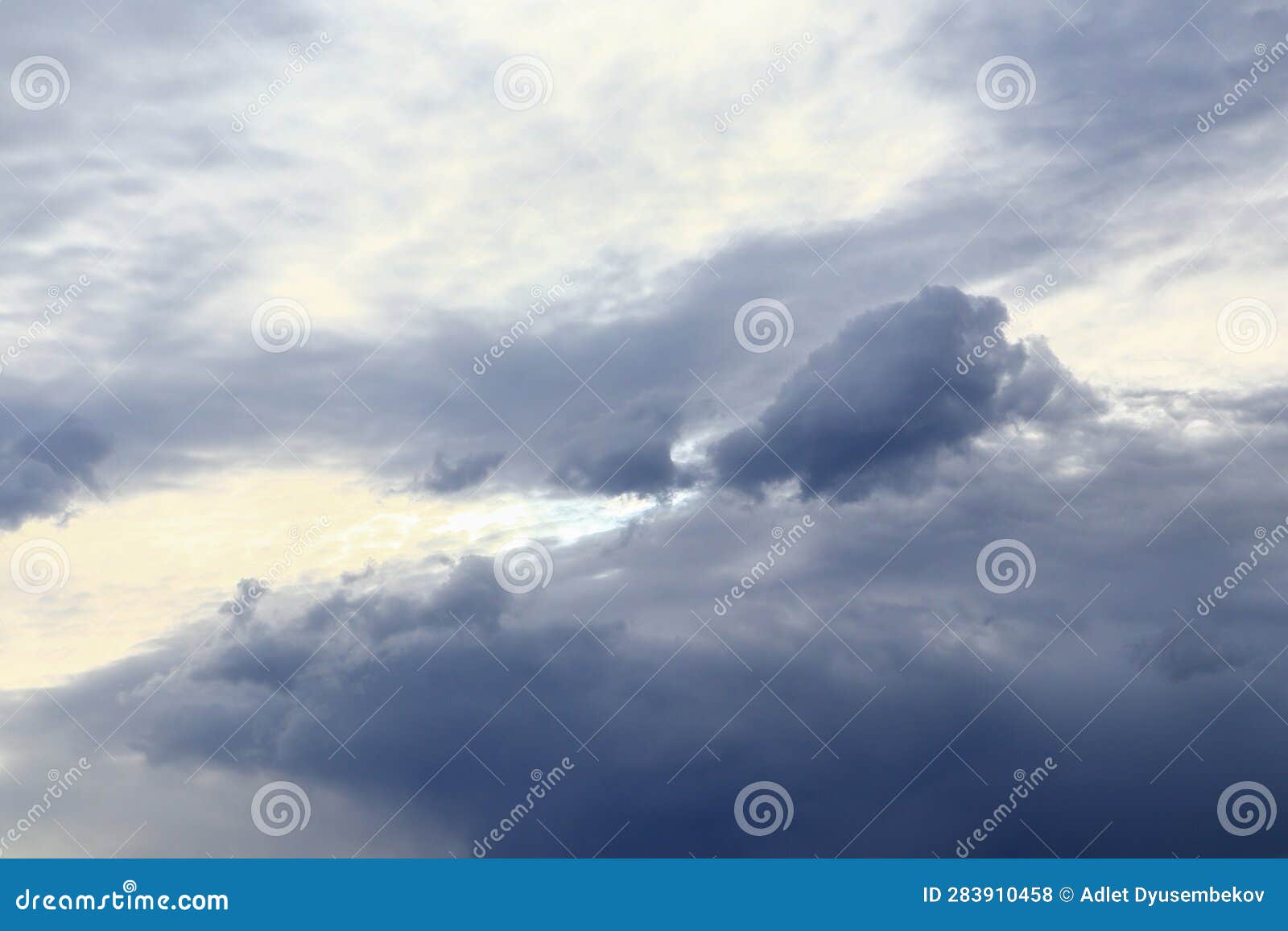 Gray Storm Clouds Float Across a Bright Sky, Marking the Start of a ...