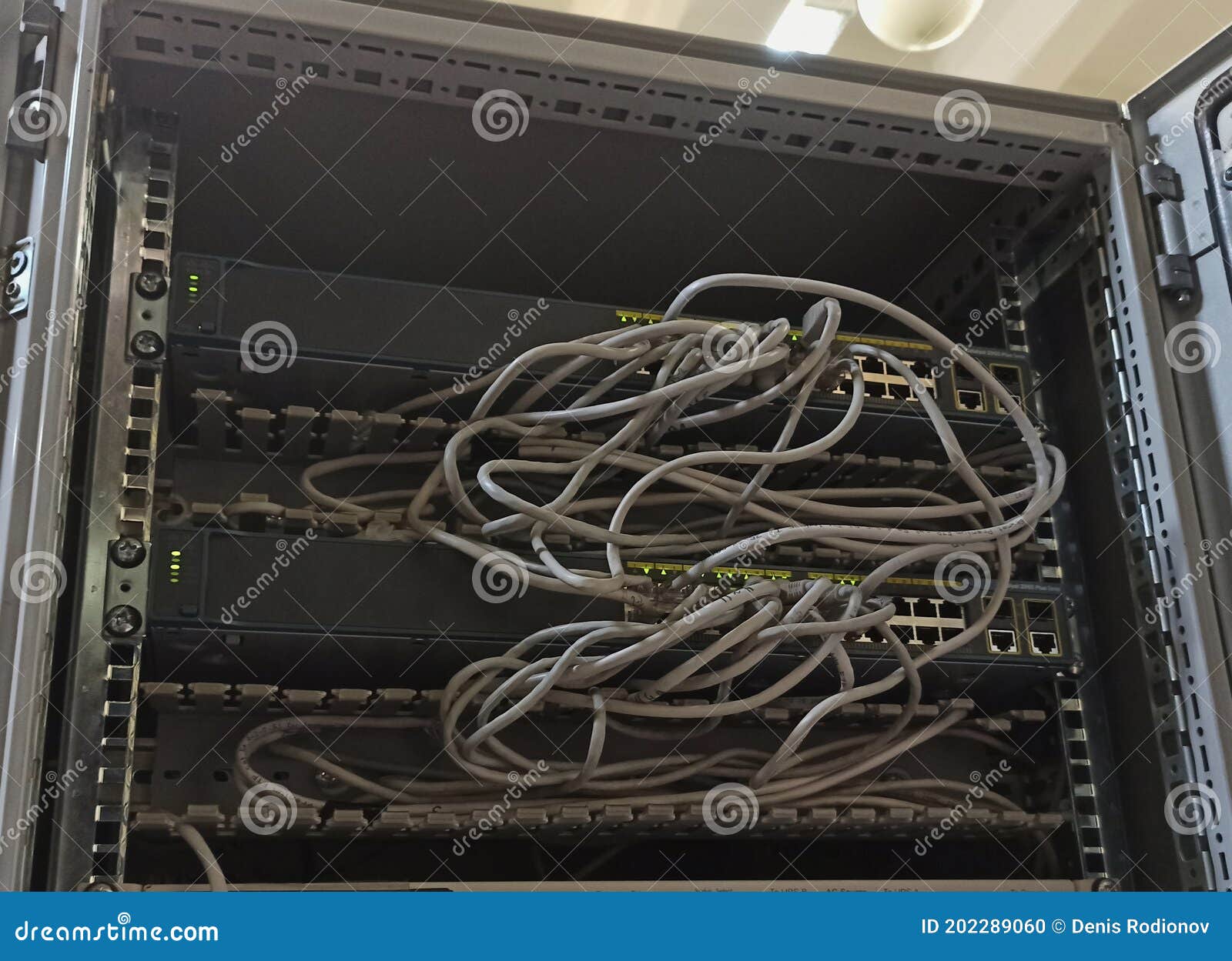 Gray Tangled Wires In The Server Room. A Cobweb Made Of Wires Of The ...