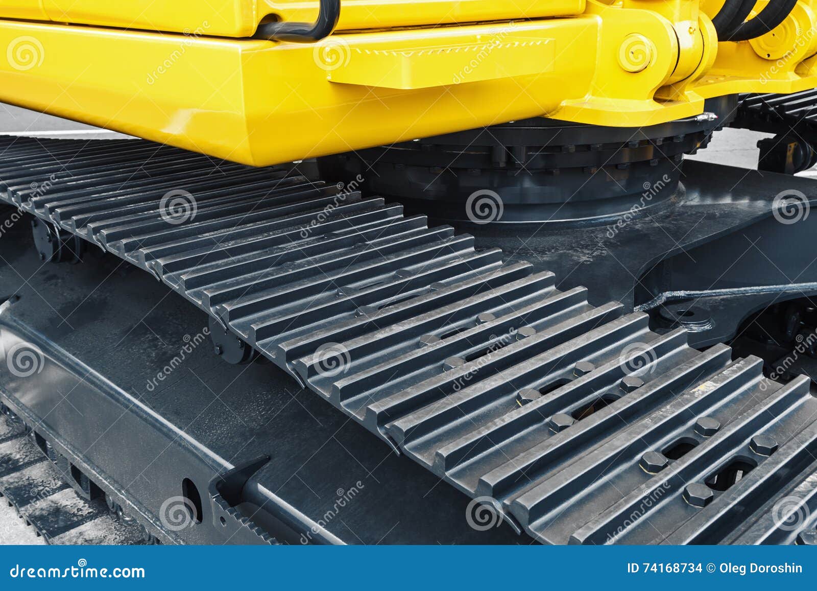 Gray Tracks on a Yellow Excavator Stock Photo - Image of excavate ...