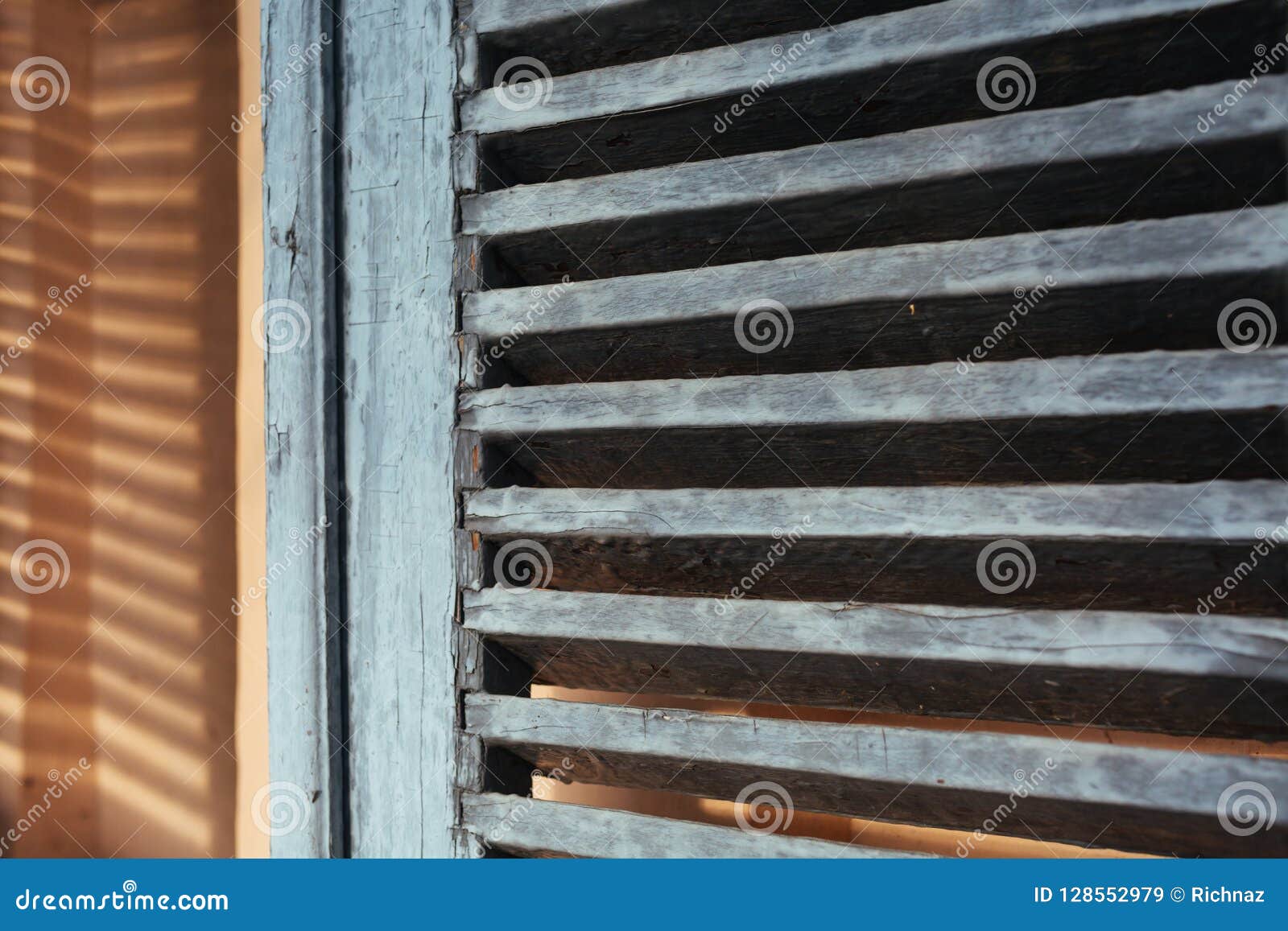 Gray Wooden Open Blinds. Shadow on the Yellow Wall Stock Image - Image ...