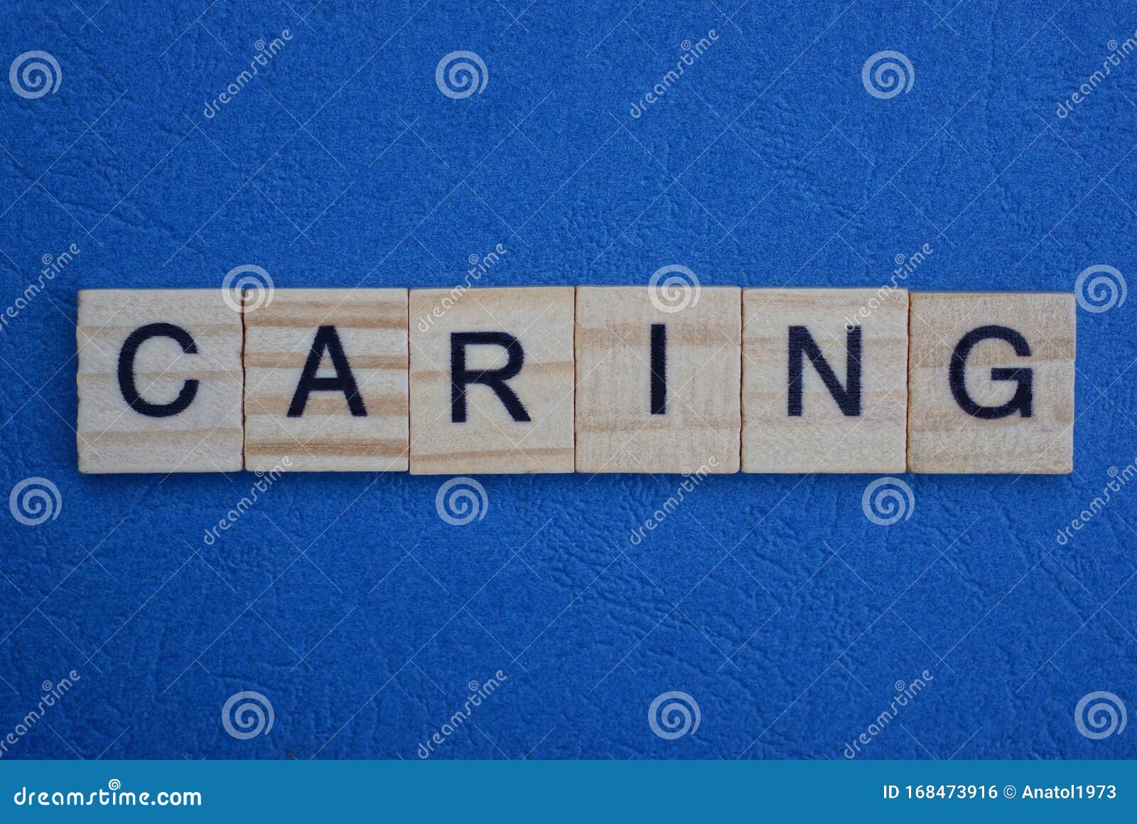 Gray Word Caring from Small Wooden Letters Stock Photo - Image of block ...