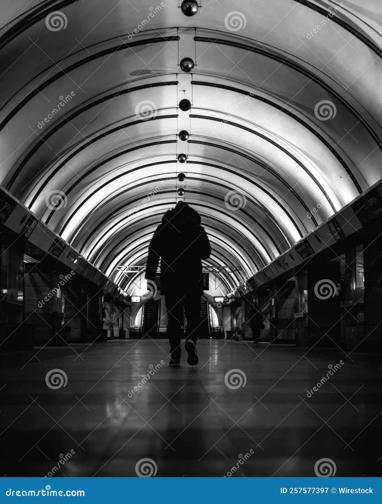 Grayscale Back View of a Man Walking in the Subway Station - Dramatic ...