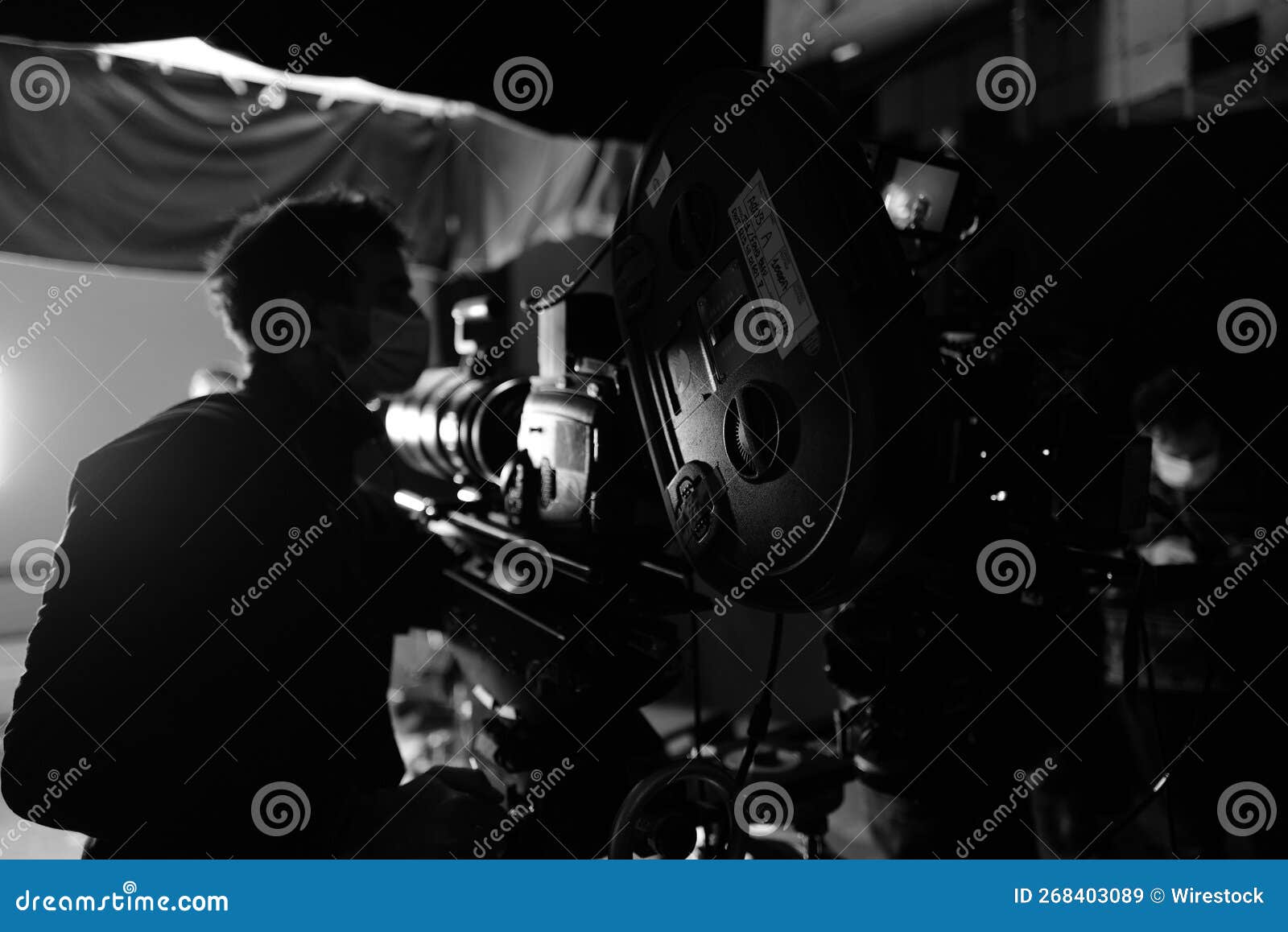 Grayscale of a Cameraman in a Mask Near the Camera Stock Image - Image ...