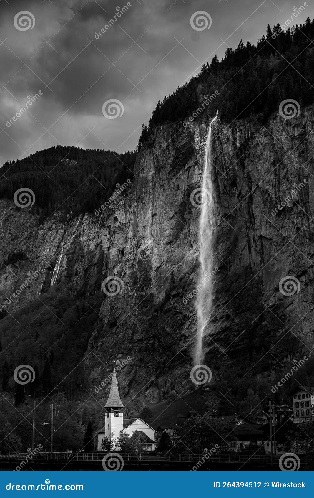 Grayscale of a Church and Waterfall Flowing from a Cliff with Trees ...