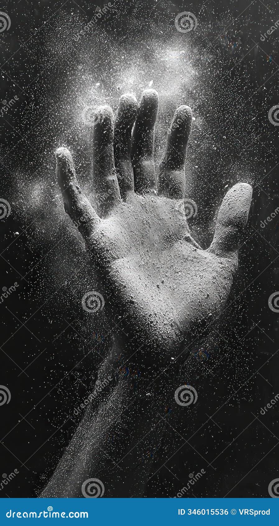 Grayscale Hand with Dust Particles Against Dark Backdrop Stock Photo ...