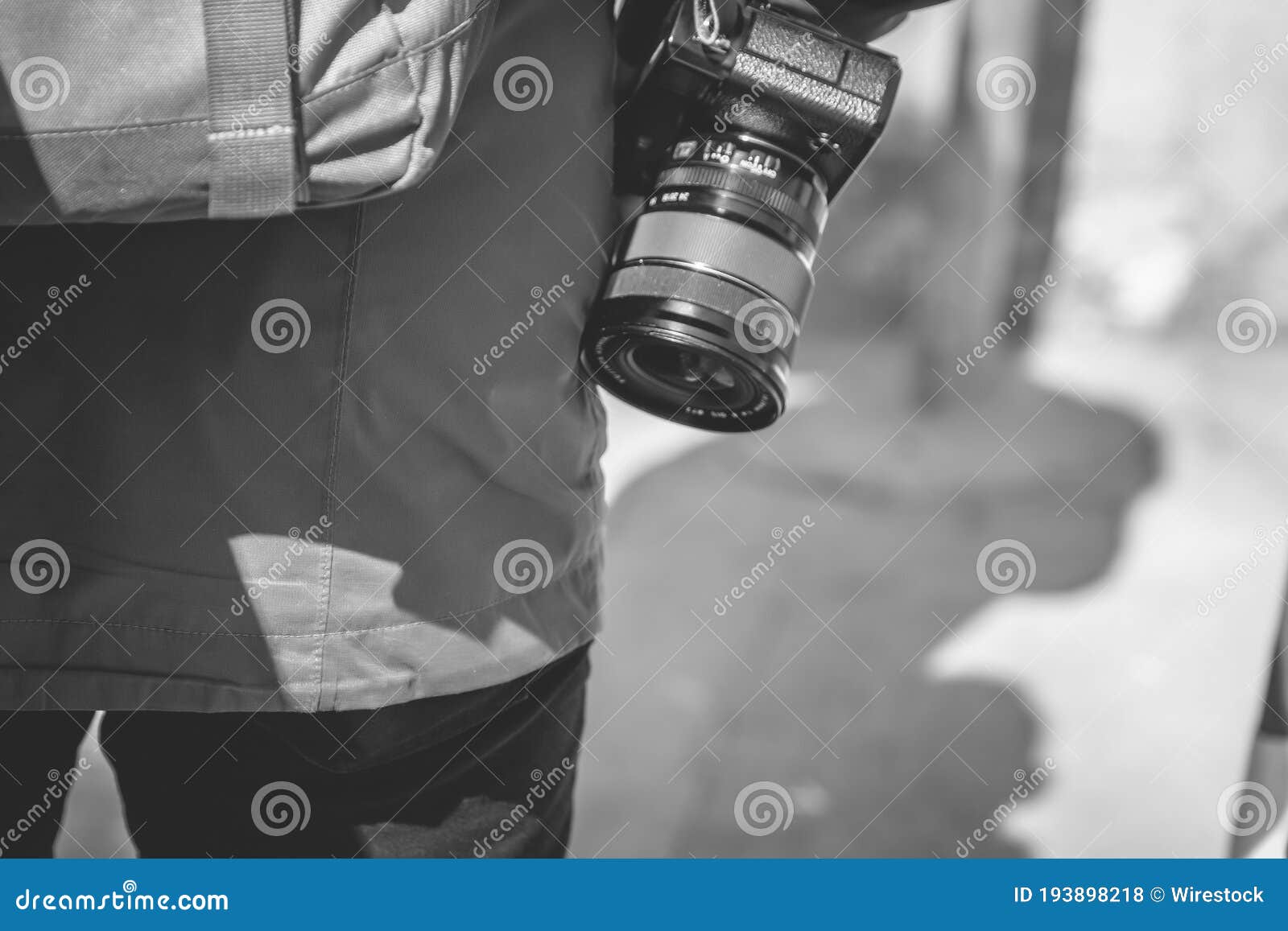 Grayscale Closeup Shot of a Photographer with a Camera, View from the ...