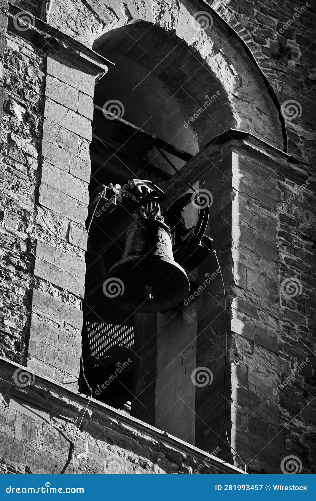 Grayscale of a Large Bell Suspended on the Wall of an Outdoor Structure ...