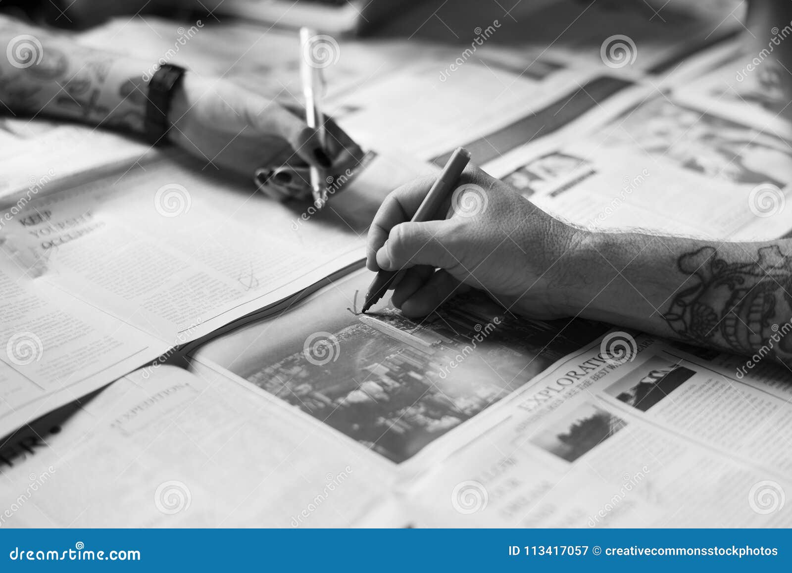 Grayscale Photo Of Hands Writing On The Newspaper Picture. Image: 113417057