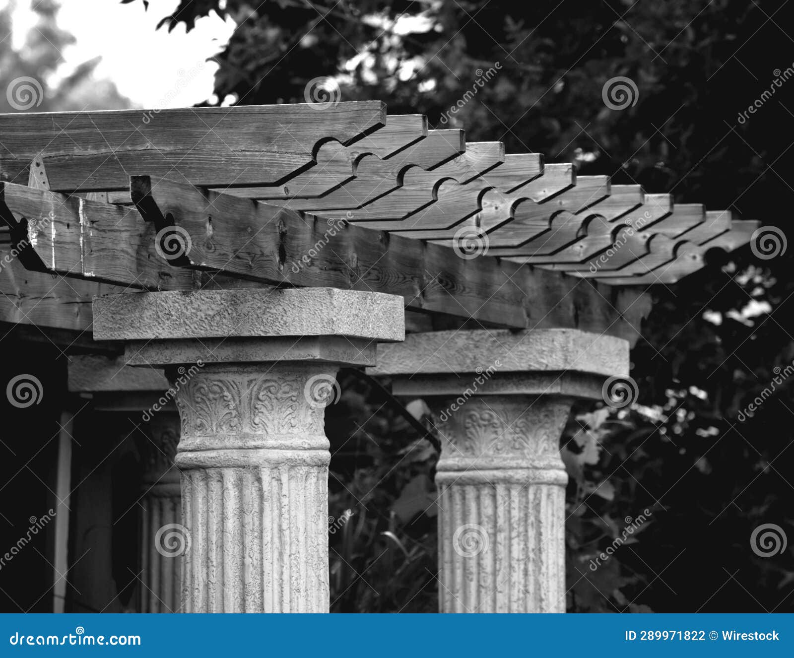 Grayscale of Roman Columns Topped with a Wooden Pergola Structure Stock ...