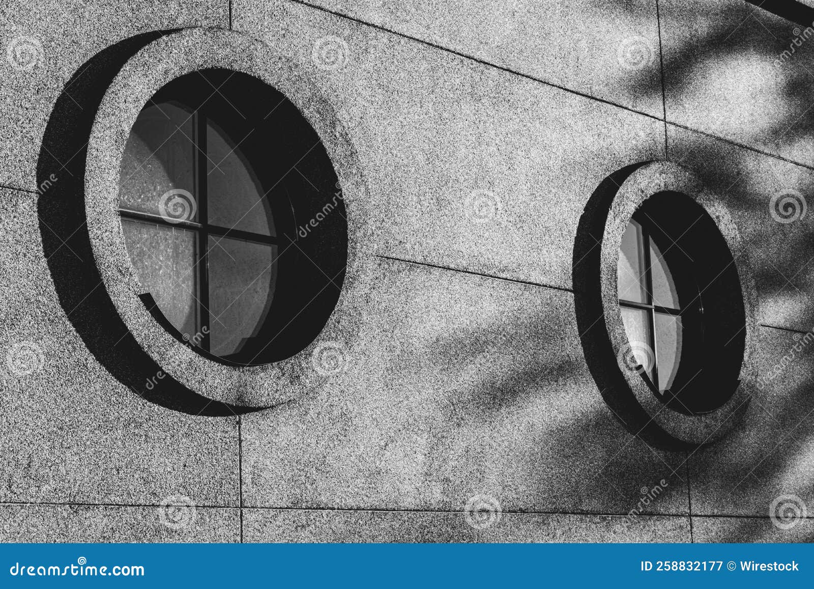Grayscale of Round Modern Windows on a Stone Building Stock Image ... Grayscale of Round Modern Windows on a Stone Building Stock Image ...