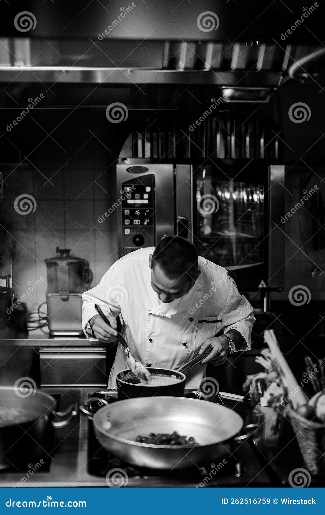Grayscale Shot of a Caucasian Male Chef Cooking Inside a Kitchen Stock ...