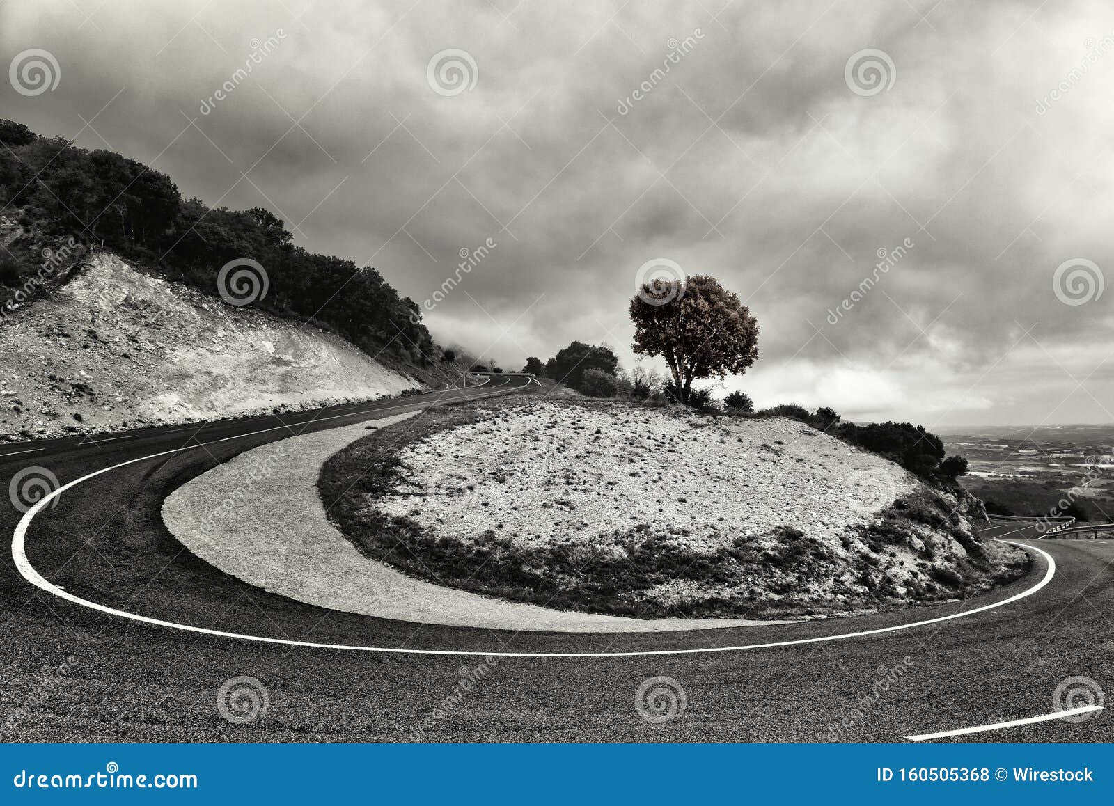 Grayscale Shot of a Curvy Sharp U-turn on the Countryside Road Stock ...