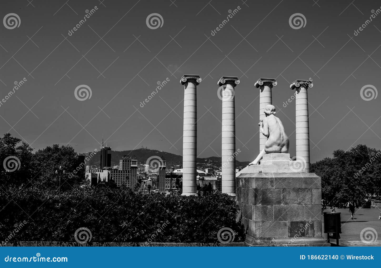 Grayscale Shot of a Female Statue from the Back and Four Arches Stock ...