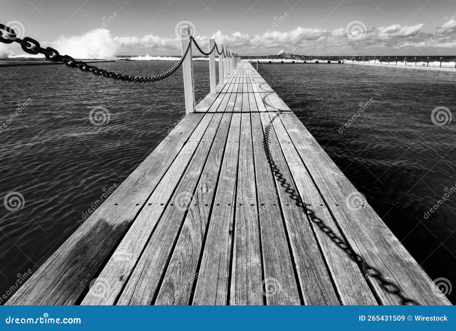 Grayscale Shot of a Long Wooden Dock with a Chain Stock Image - Image ...