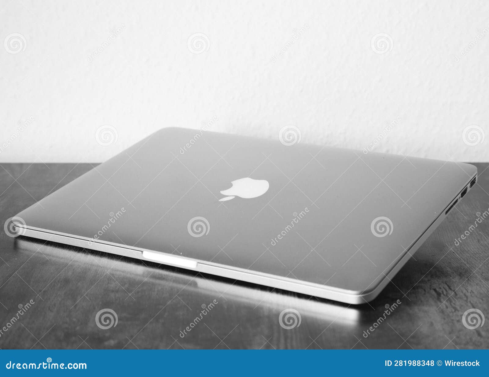 Grayscale Shot of a Macbook Pro on the Table Editorial Stock Photo ...