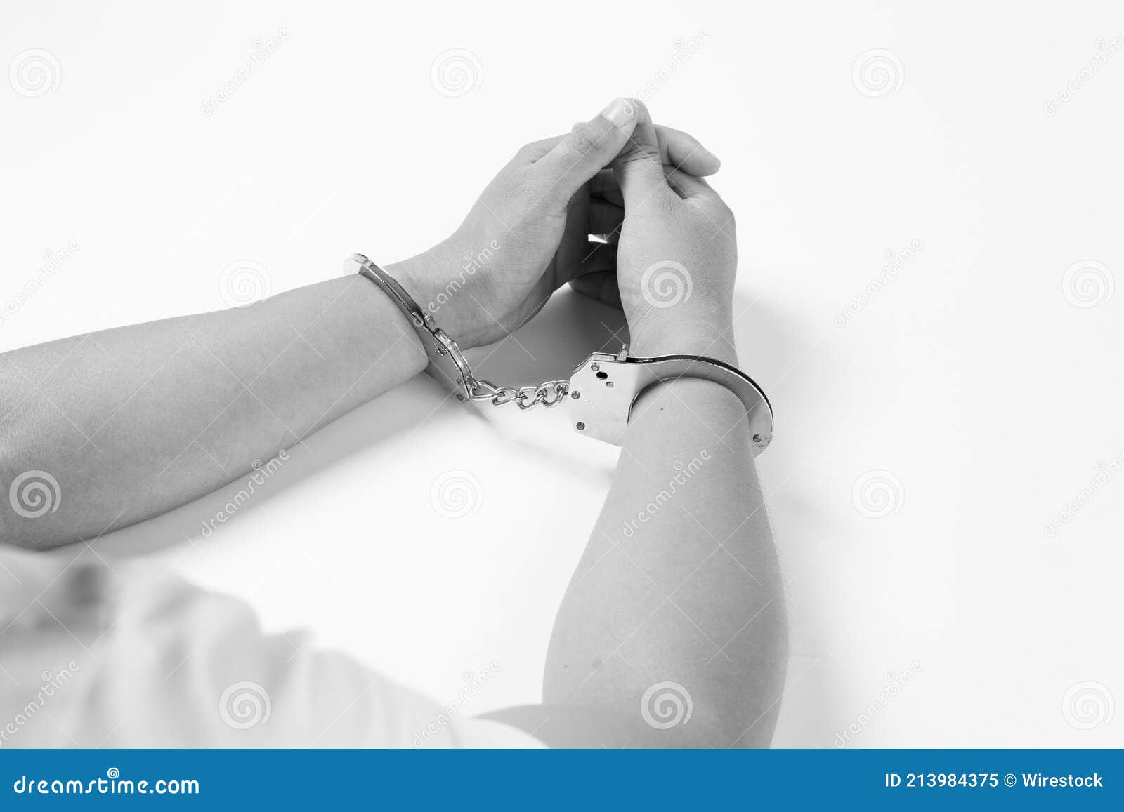 Grayscale Shot of Male Hands in Handcuffs on White Background Stock ...