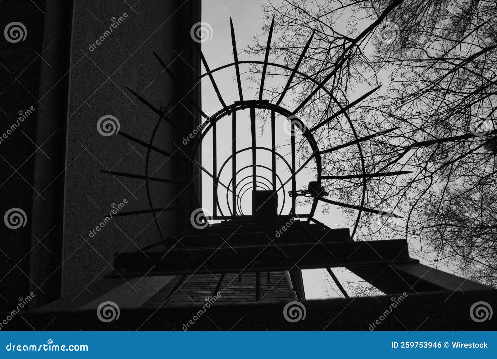 Grayscale Shot of a Metal Frame with Spikes on a Building. Stock Photo ...